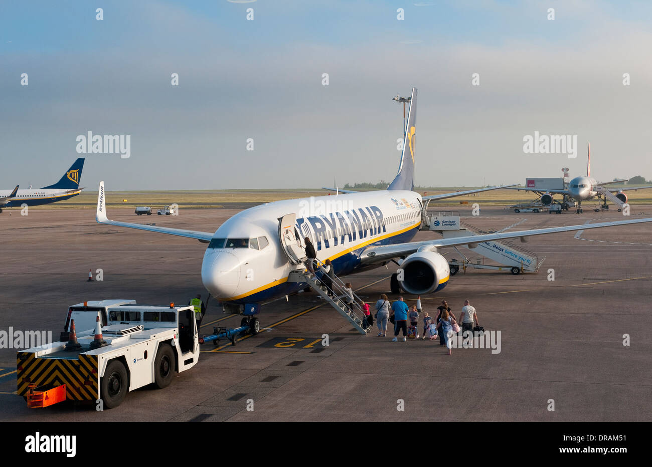 Passengers boarding a Ryanair plane at an airport Stock Photo - Alamy