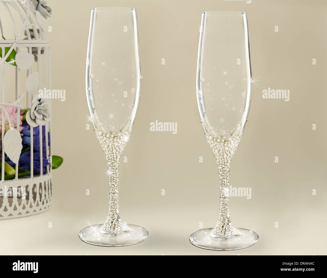 Two fancy wedding goblets glasses on tender background Stock Photo - Alamy