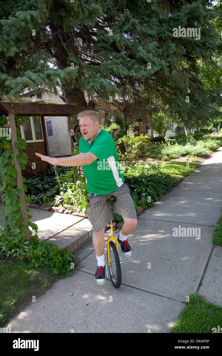 Man riding unicycle hi-res stock photography and images - Alamy