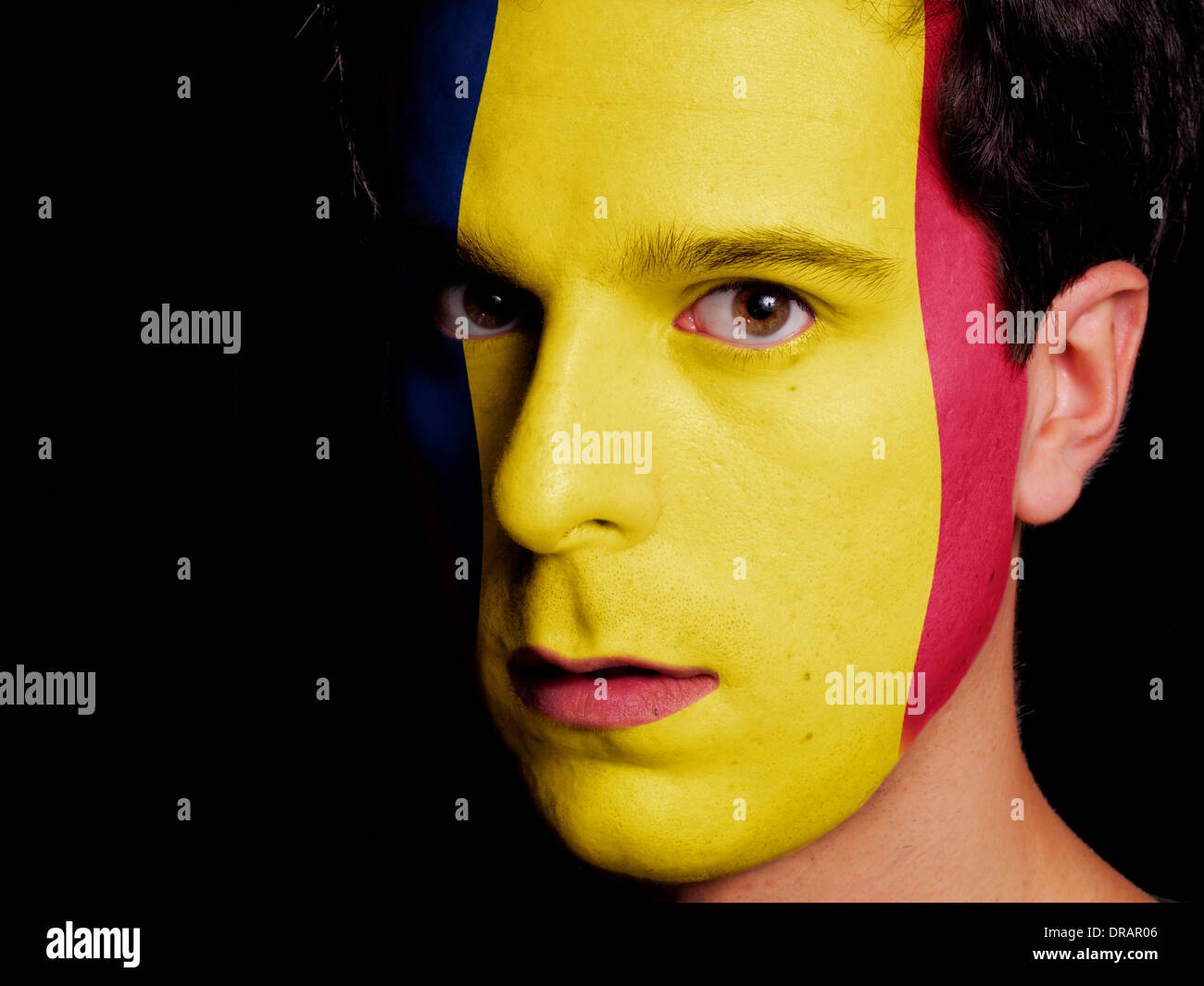 Flag of Chad Painted on a Face of a Young Man Stock Photo - Alamy