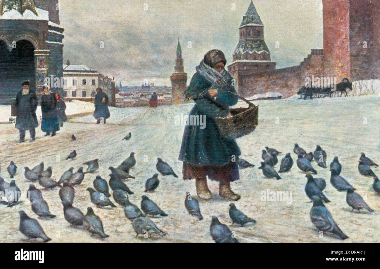 Russian woman feeding pigeons Stock Photo - Alamy