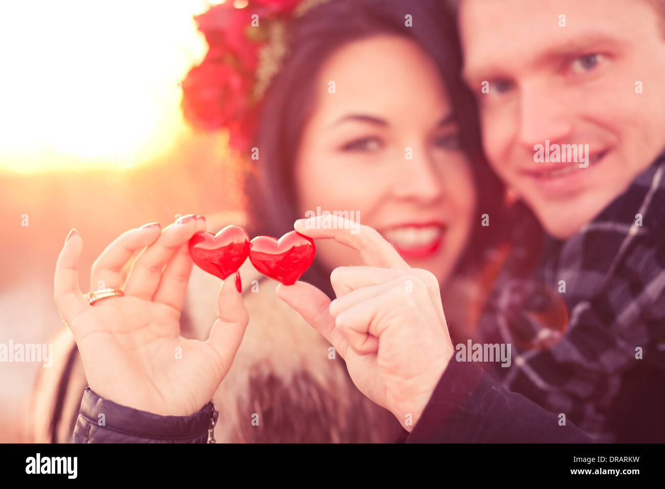 Young couple are holding pair of hearts as a symbol of their love Stock ...