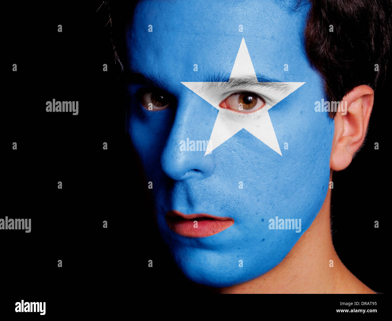 Flag of Somalia Painted on a Face of a Young Man Stock Photo - Alamy