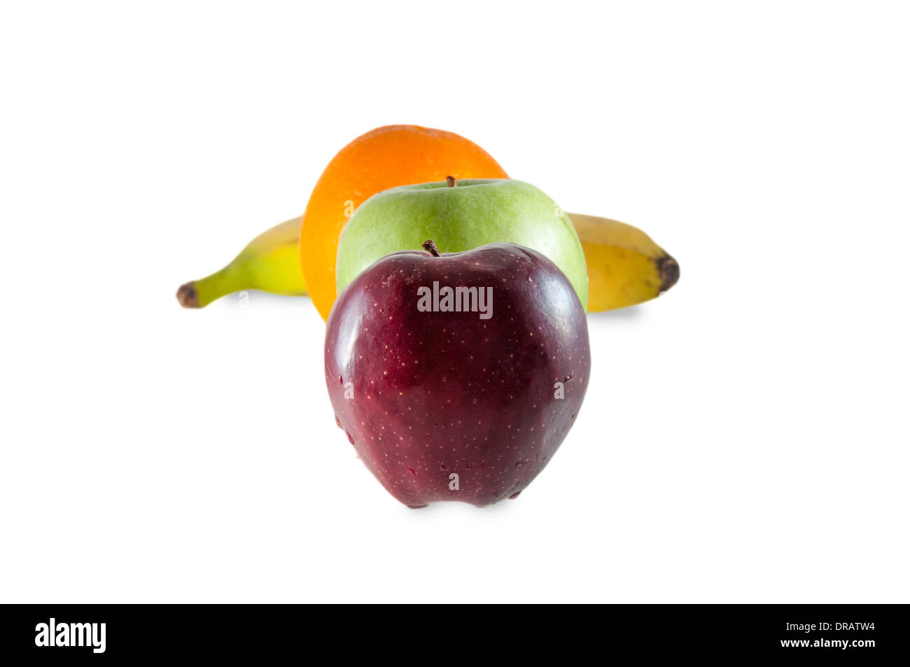 Two apples an orange and a banana forming a curve on a white background ...