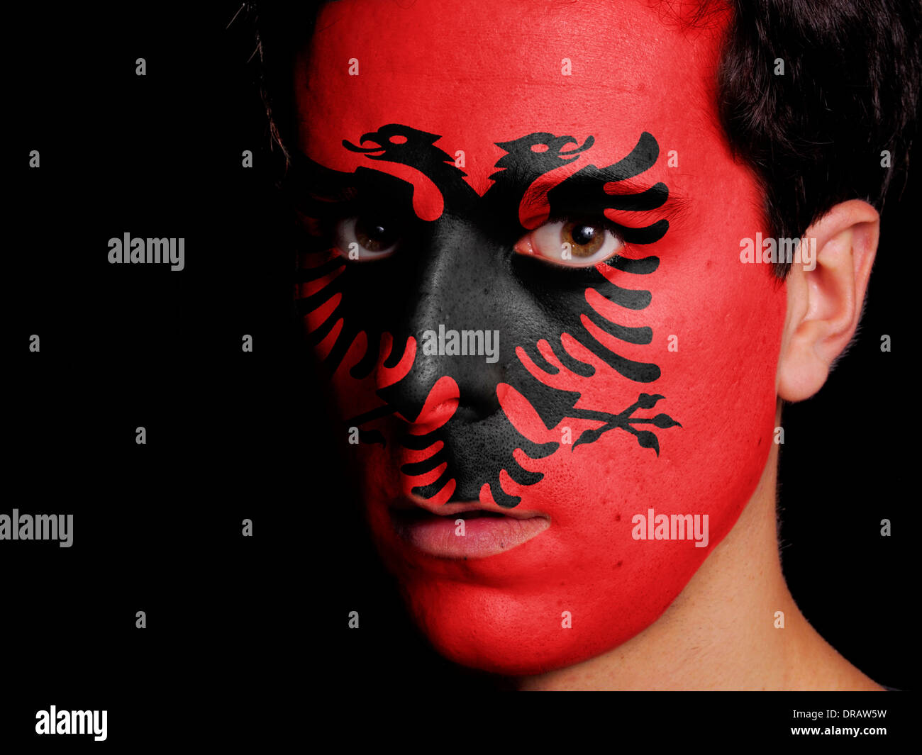 Flag of Albania Painted on a Face of a Young Man Stock Photo - Alamy