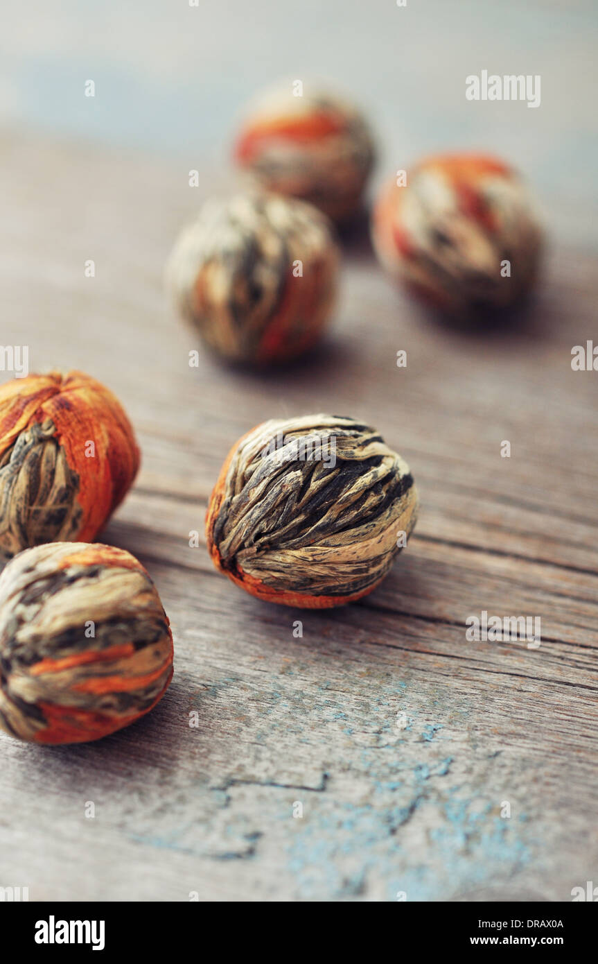 Chinese Green Tea Balls with Lychee Flower on wooden background Stock ...
