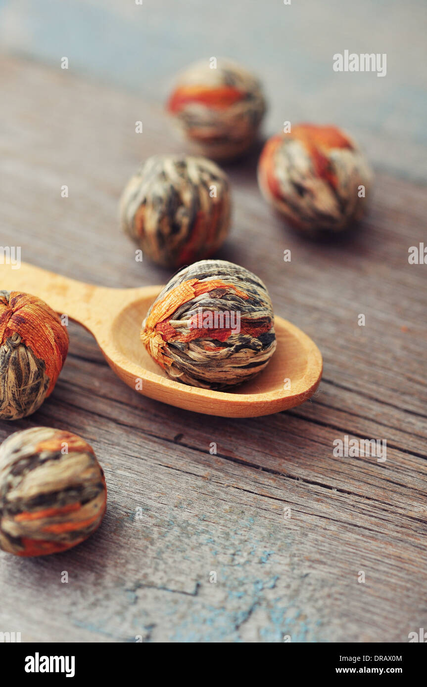 Chinese Green Tea Balls with Lychee Flower on wooden background Stock ...