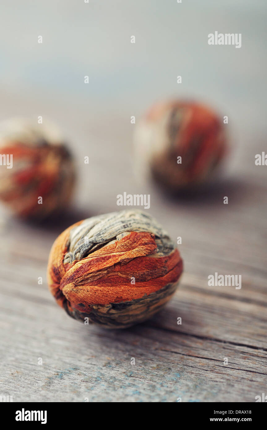 Chinese Green Tea Balls with Lychee Flower on wooden background Stock ...