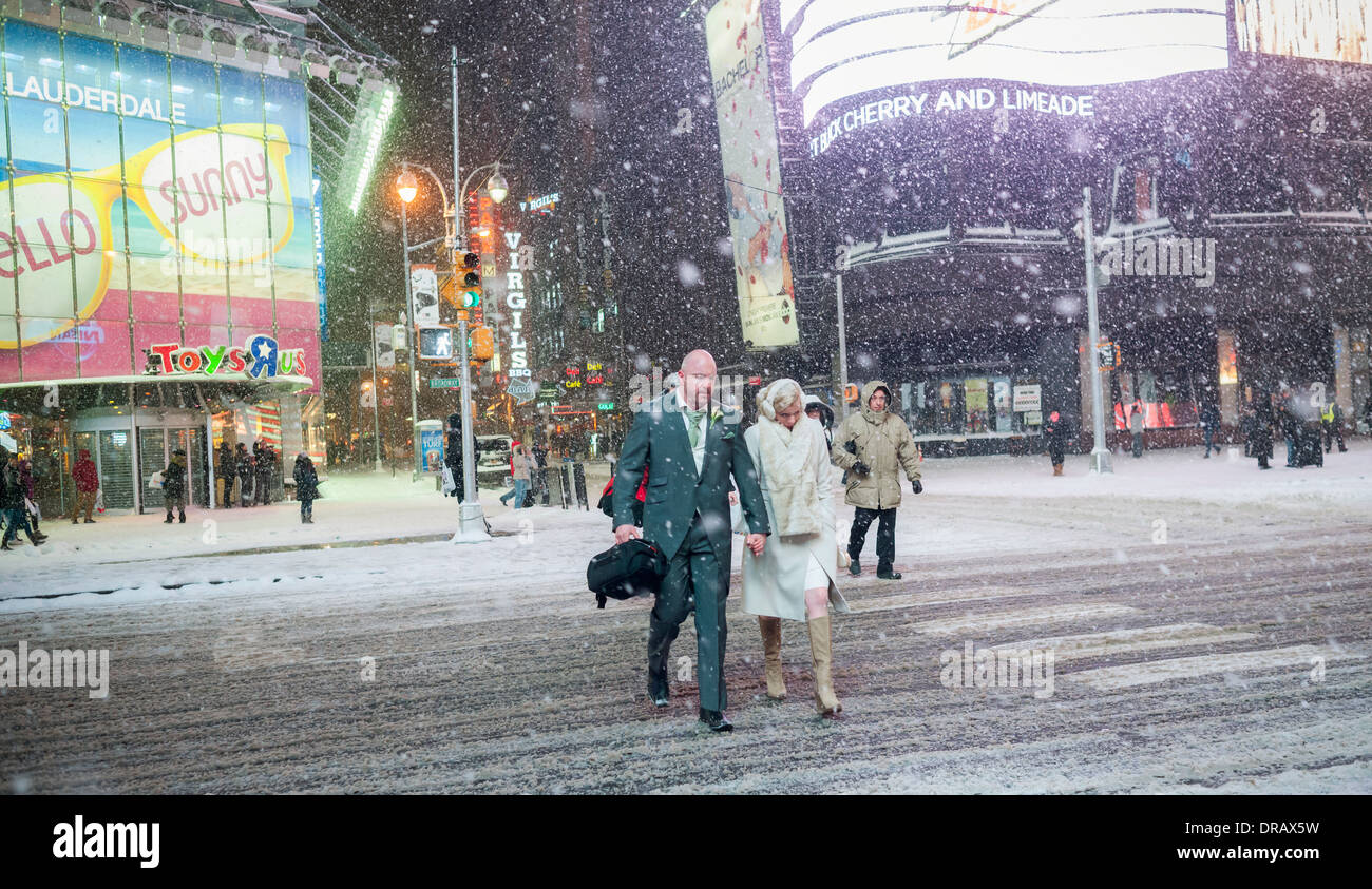 Visitors to Times Square in New York during a snow storm Stock Photo ...