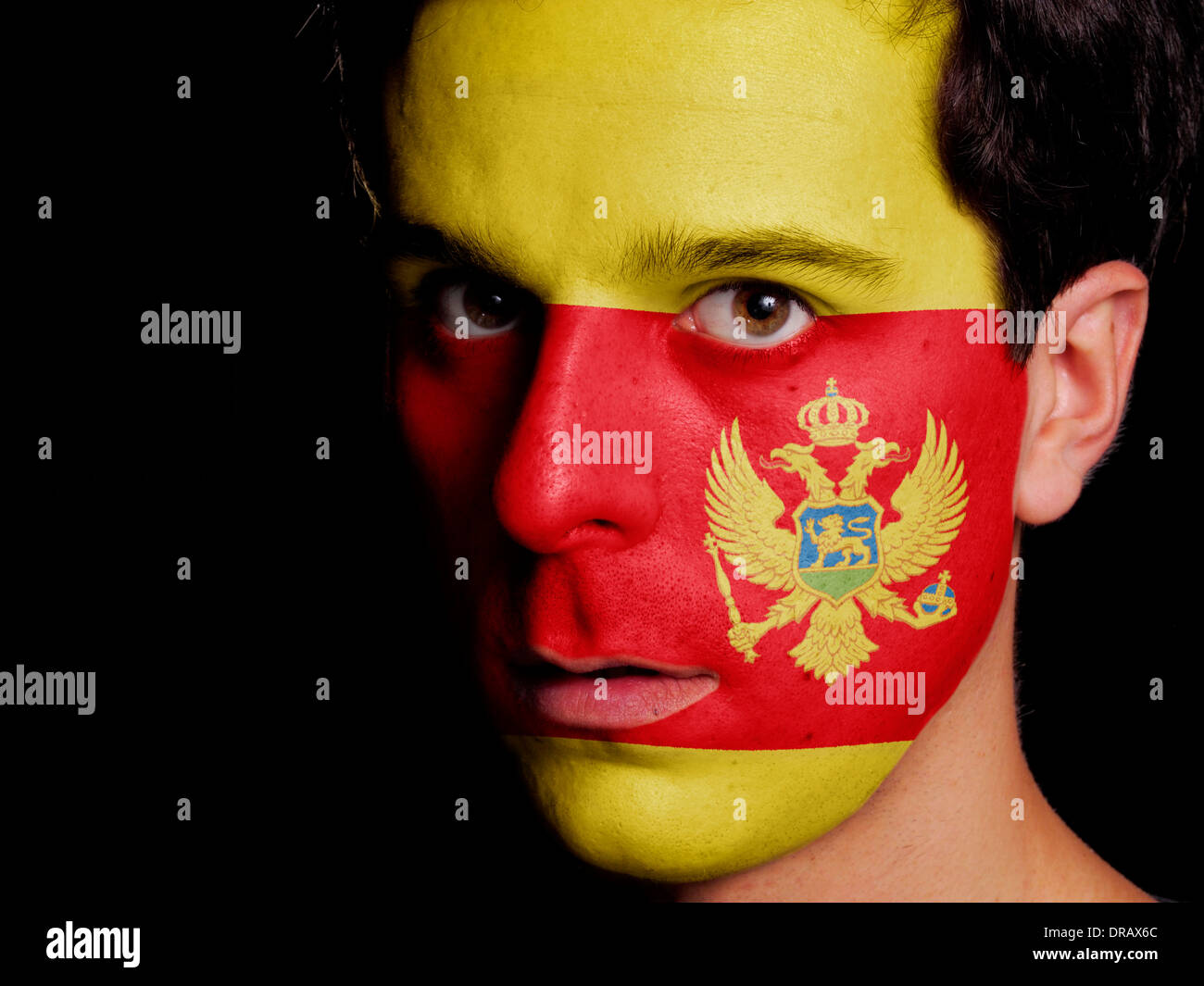 Flag of Montenegro Painted on a Face of a Young Man Stock Photo - Alamy