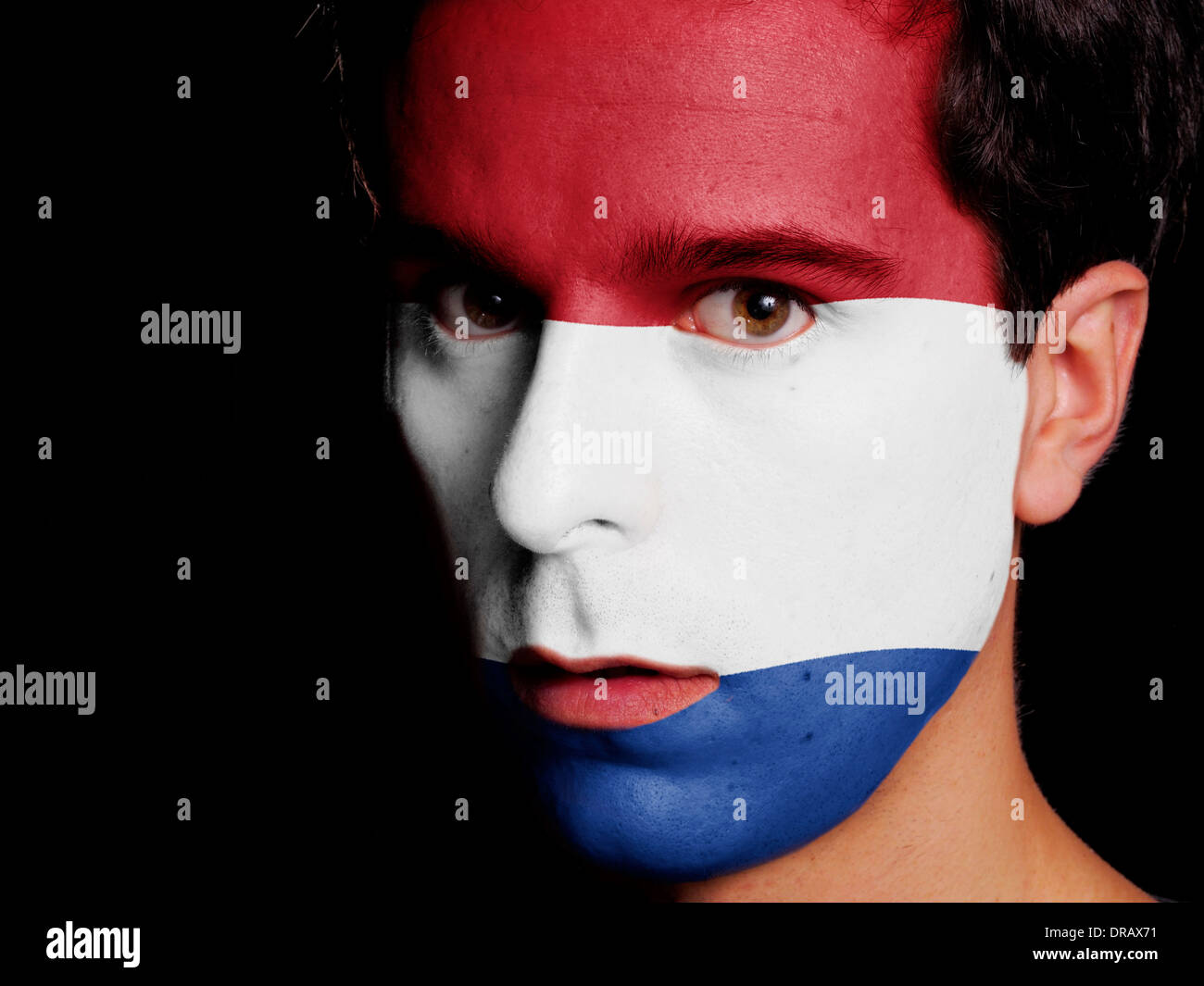 Flag of Netherlands Painted on a Face of a Young Man Stock Photo - Alamy