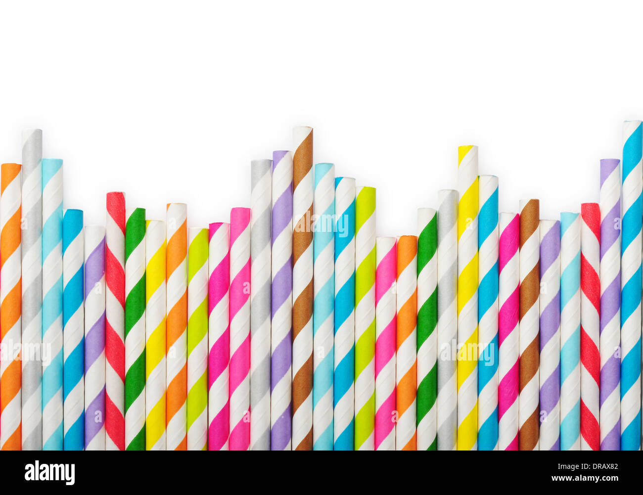 Striped drink straws of different colors in row isolated on white ...