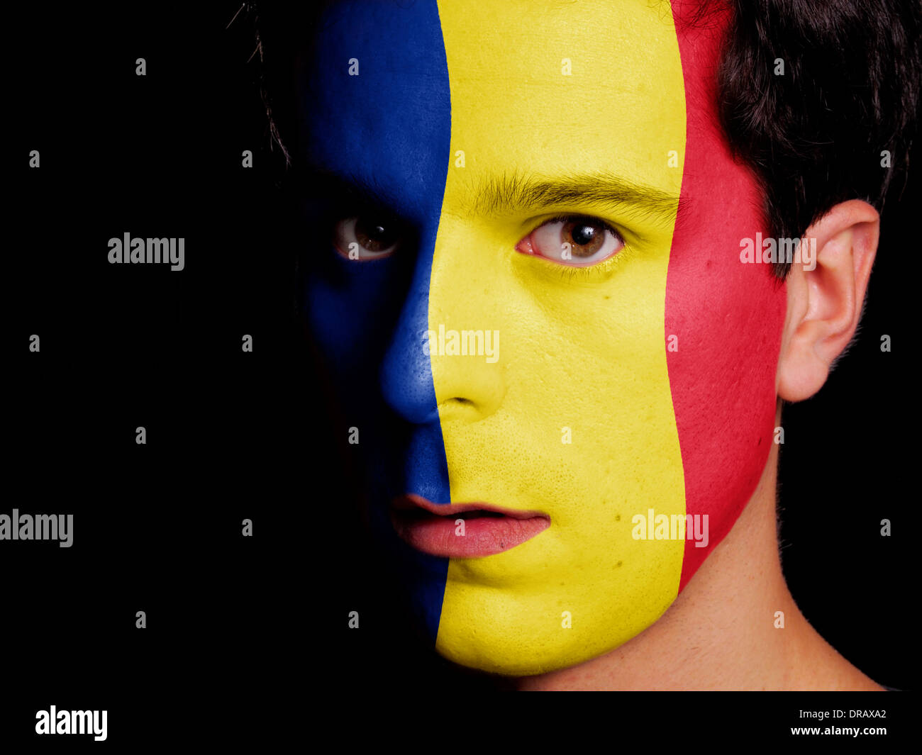 Flag of Romania Painted on a Face of a Young Man Stock Photo - Alamy