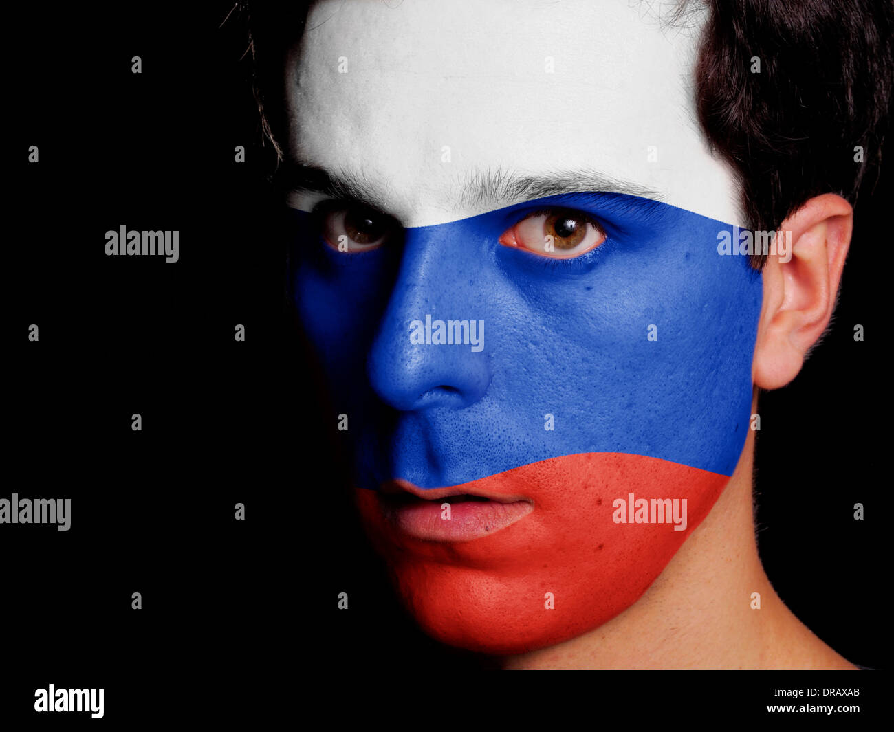 Flag of Russia Painted on a Face of a Young Man Stock Photo - Alamy