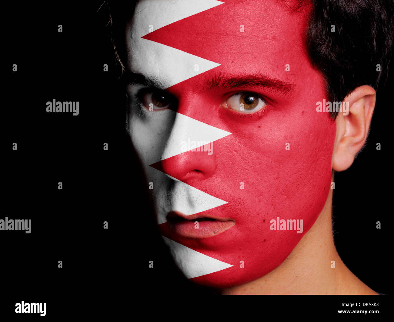 Flag of Bahrain Painted on a Face of a Young Man Stock Photo - Alamy