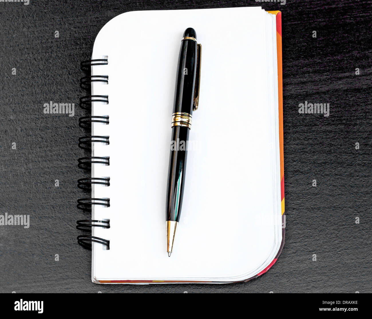 Notebook and pen in composition in black and white Stock Photo - Alamy