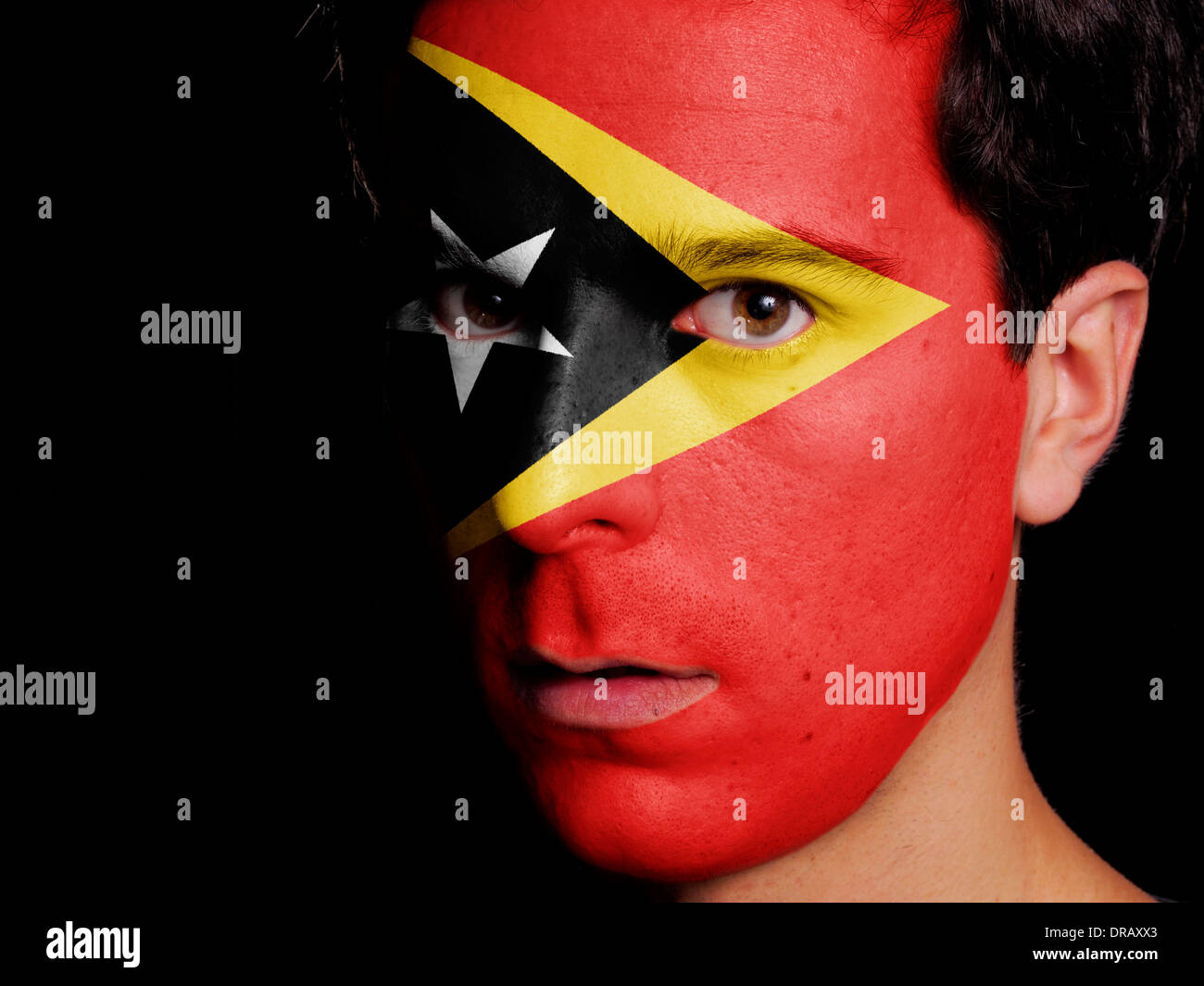 Flag of East Timor Painted on a Face of a Young Man Stock Photo - Alamy