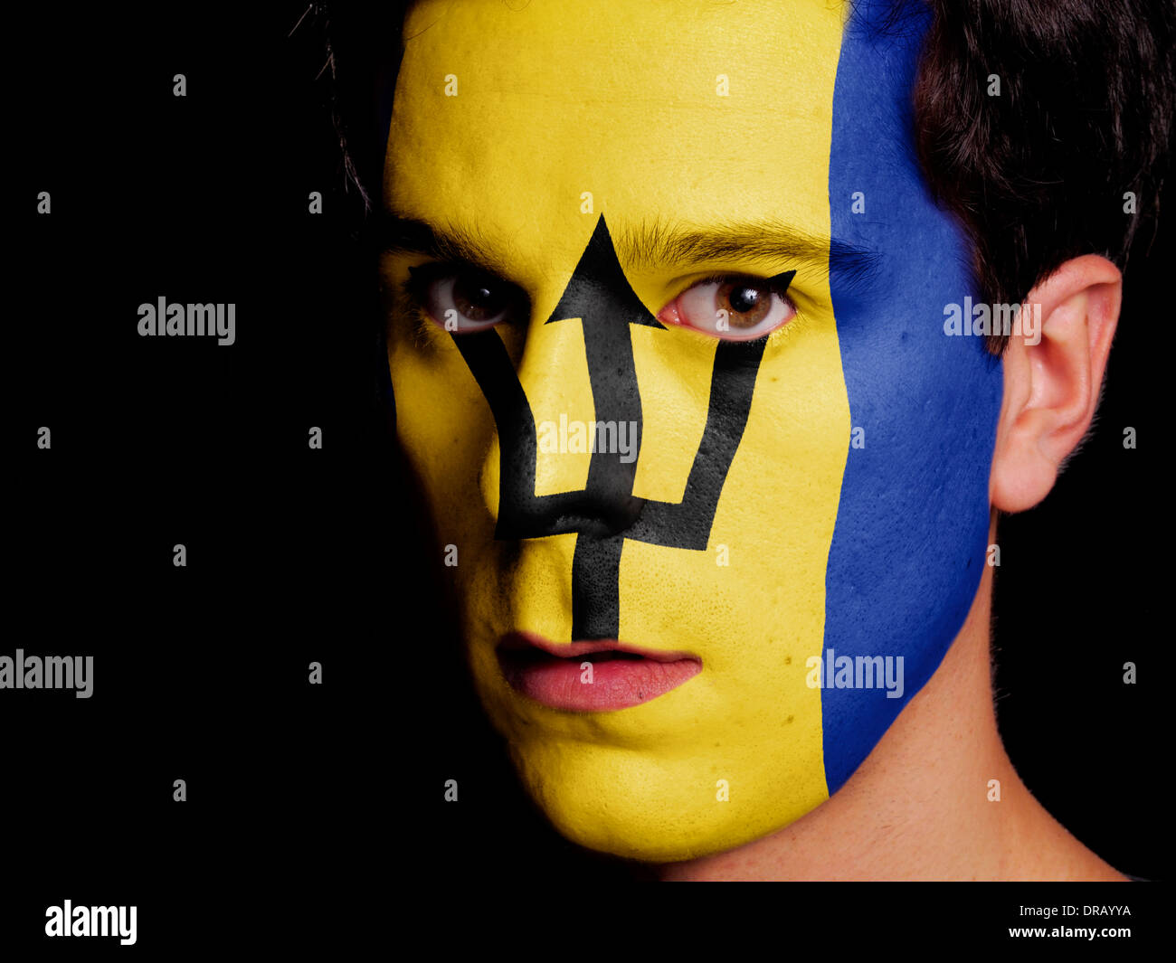 Flag of Barbados Painted on a Face of a Young Man Stock Photo - Alamy