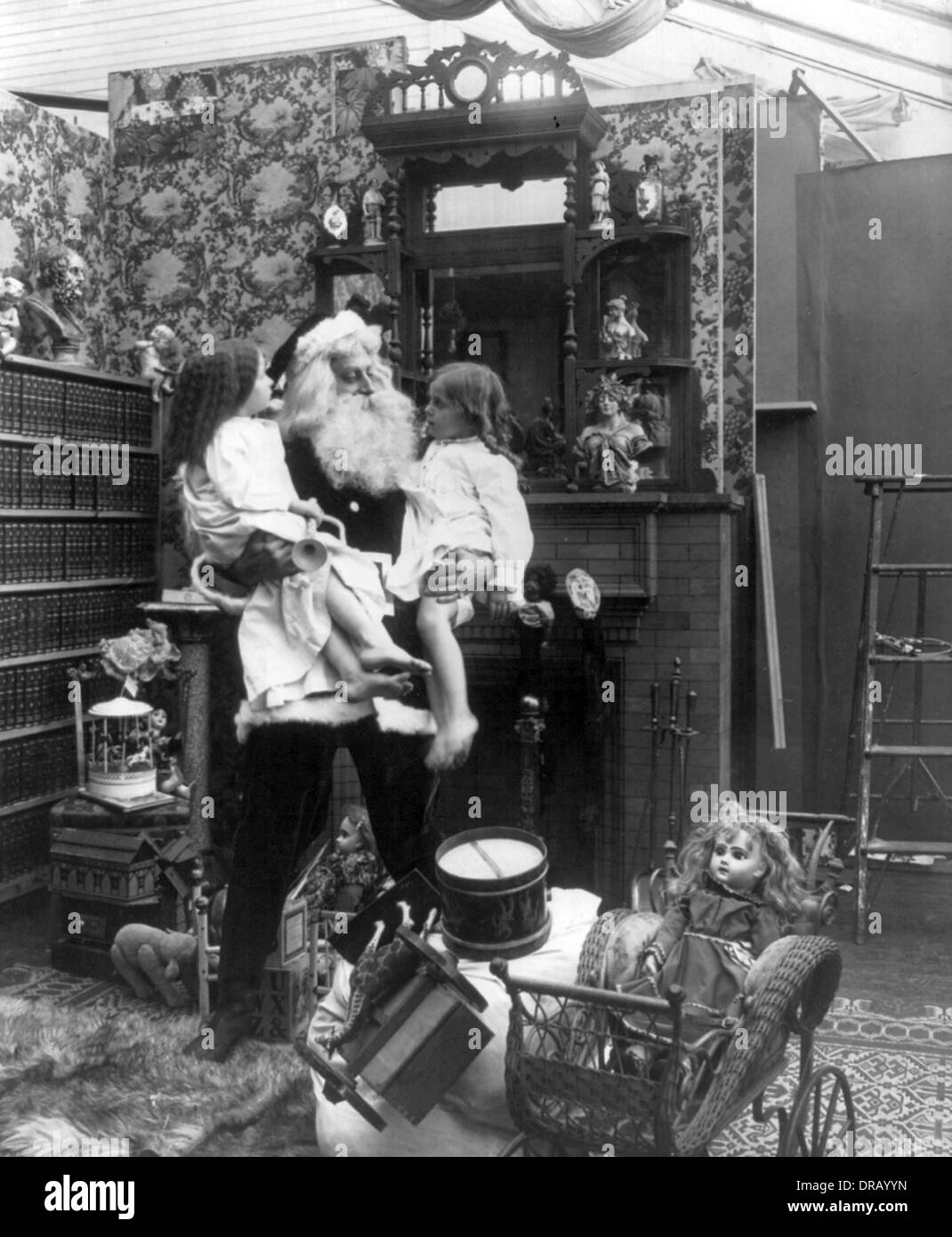 Santa Claus with children and toys Stock Photo - Alamy