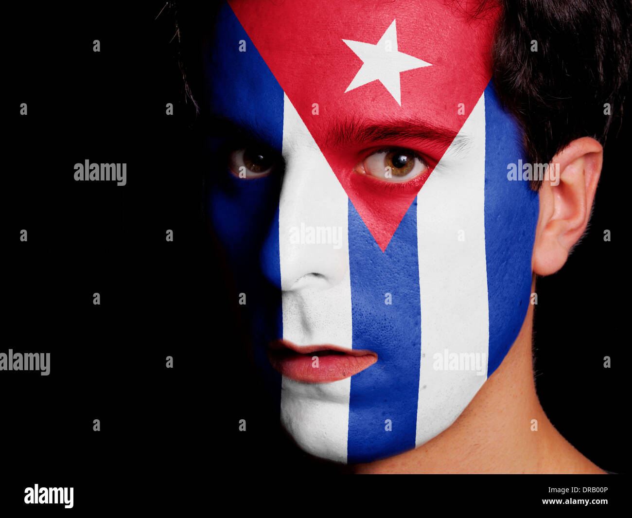 Flag of Cuba Painted on a Face of a Young Man Stock Photo - Alamy