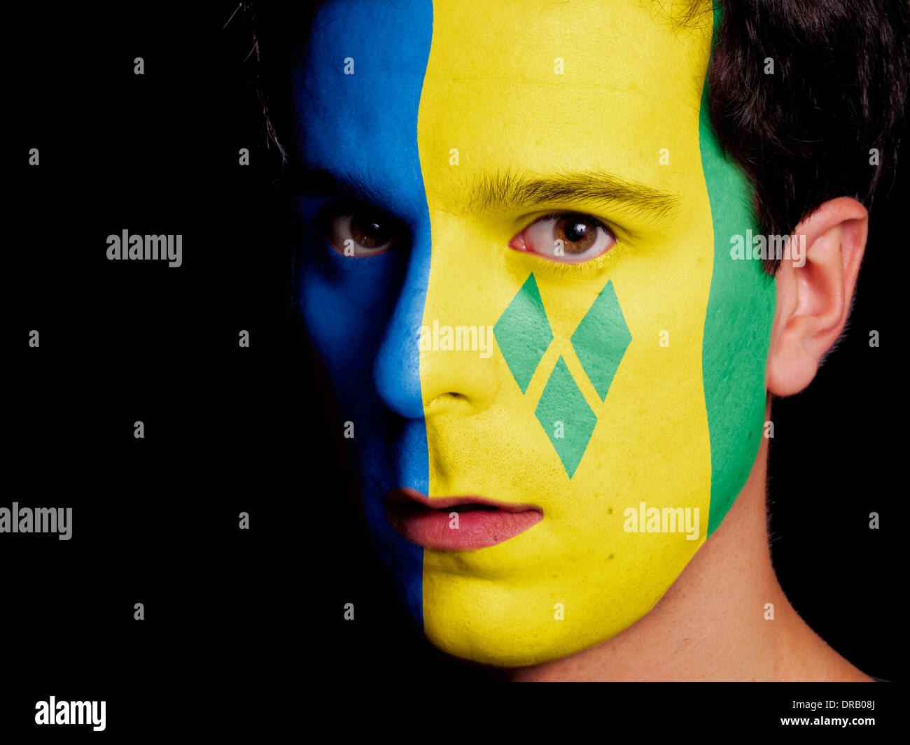 Flag of Saint Vincent and the Grenadines Painted on a Face of a Young ...