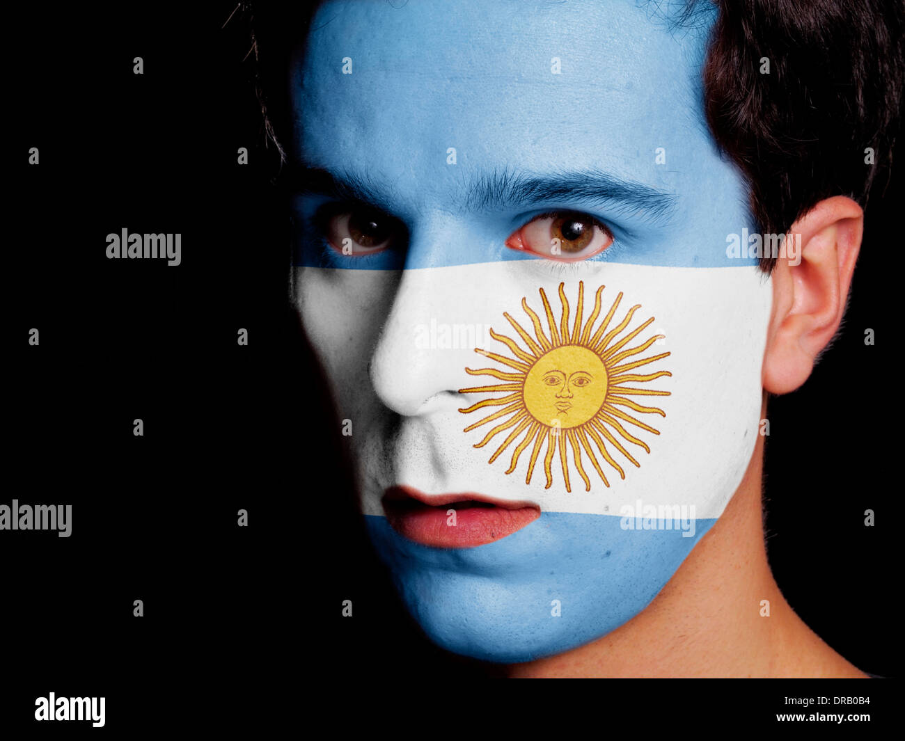 Flag of Argentina Painted on a Face of a Young Man Stock Photo - Alamy