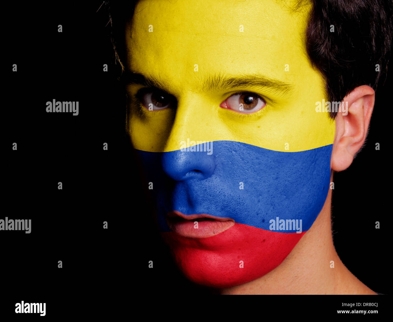 Flag of Colombia Painted on a Face of a Young Man Stock Photo - Alamy