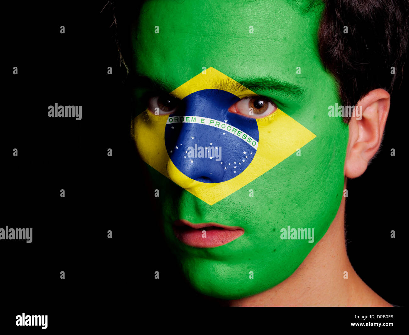 Flag of Brazil Painted on a Face of a Young Man Stock Photo - Alamy
