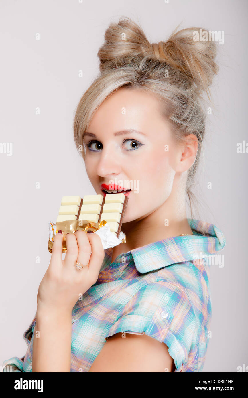 Cheerful pin up girl retro style portrait pinup Woman eating chocolate ...