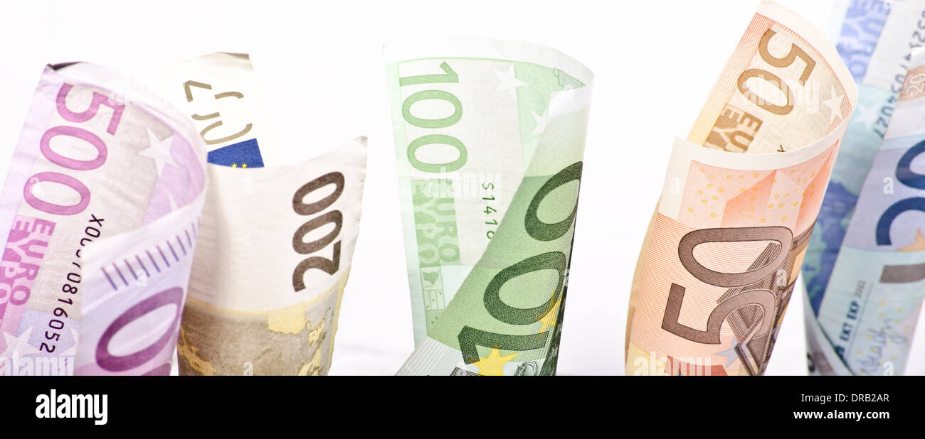 European banknotes of different value rolled on white background Stock ...