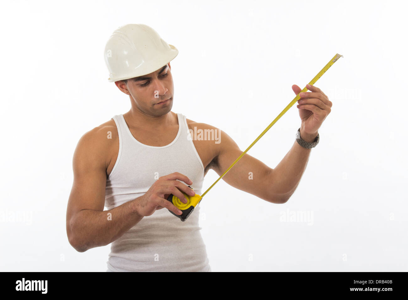 Physically fit attractive hispanic construction worker Stock Photo - Alamy
