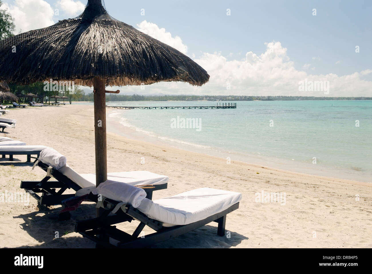 Beach chairs on beach in Mauritius Stock Photo - Alamy