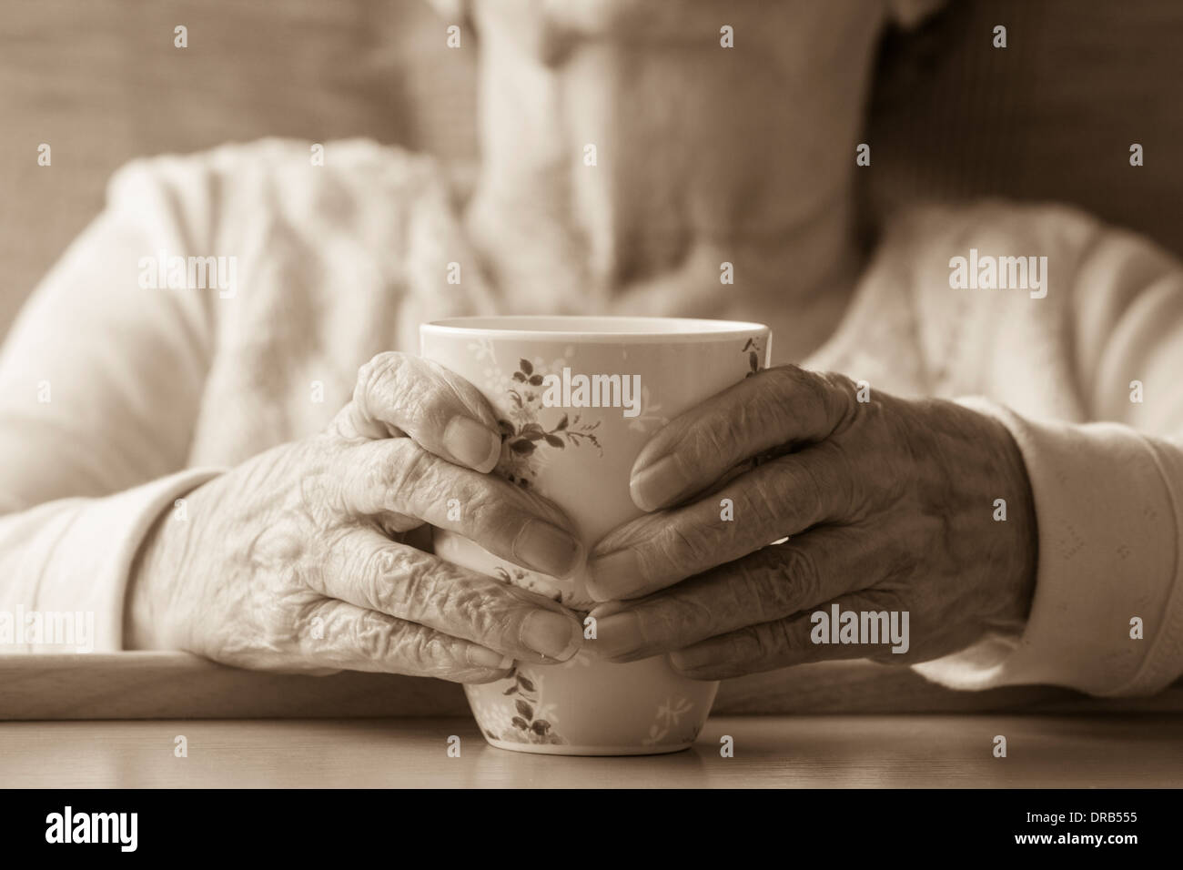 Elderly lady in her nineties holding cup of tea Stock Photo - Alamy