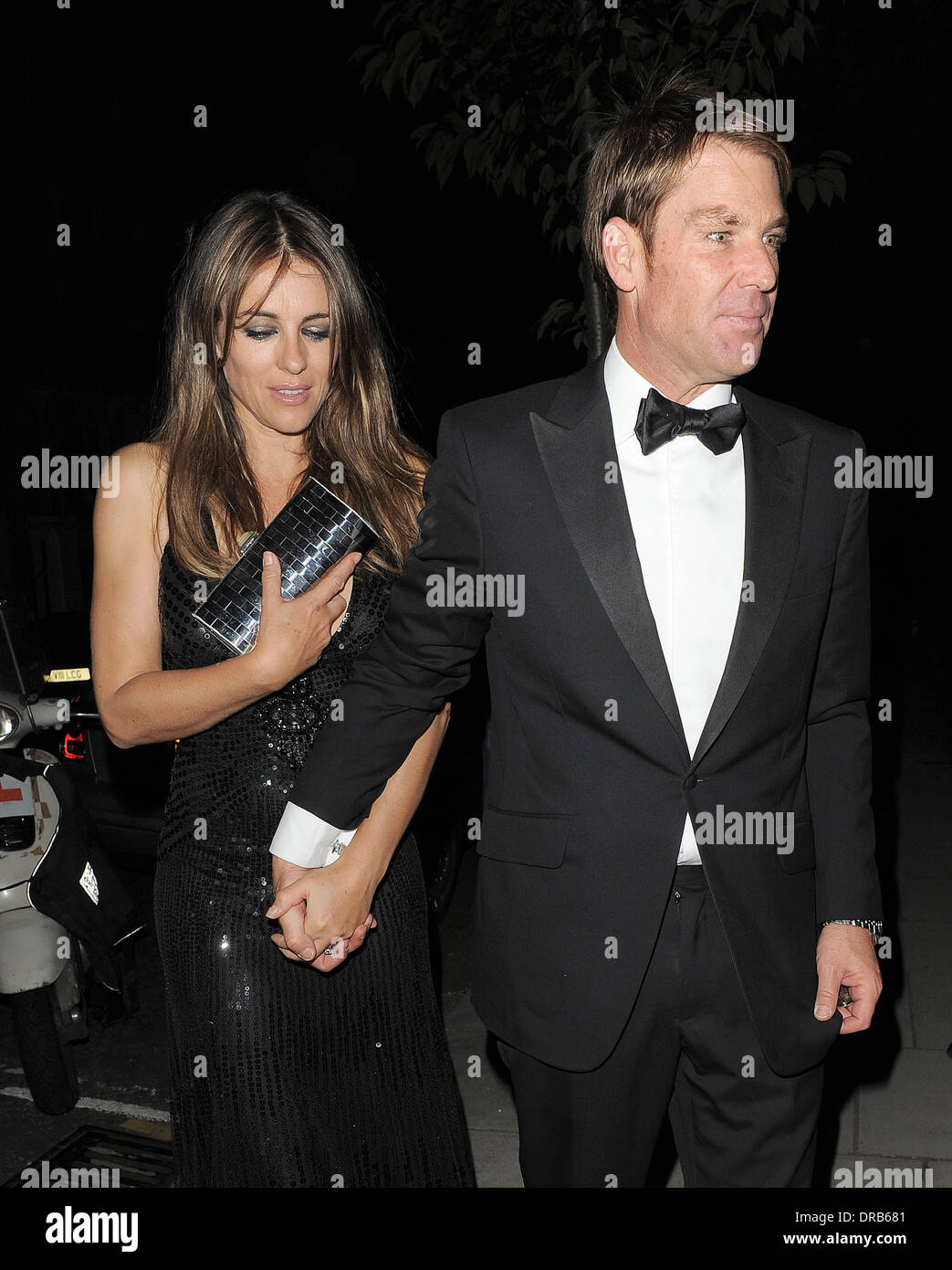 Shane Warne and Elizabeth Hurley return home, following a private party ...