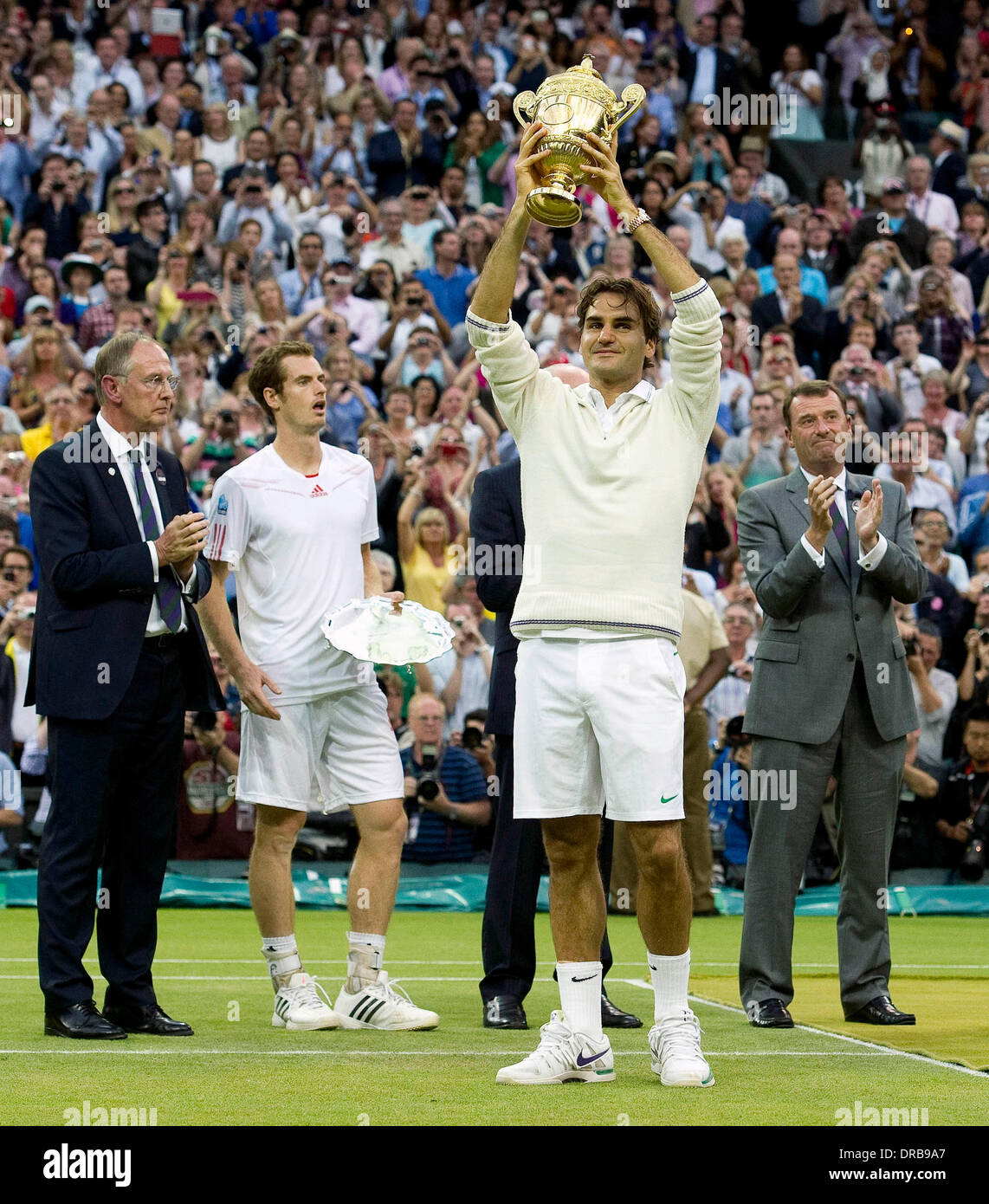 Roger Federer celebrates victory with his trophy after the Wimbledon ...