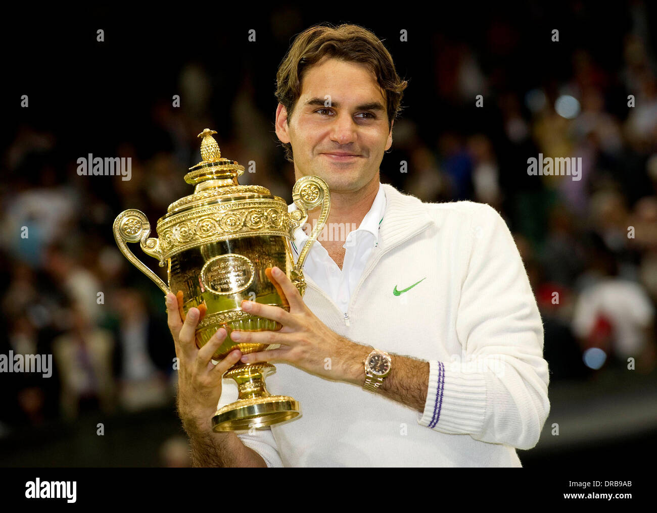 Roger Federer celebrates victory with his trophy after the Wimbledon ...