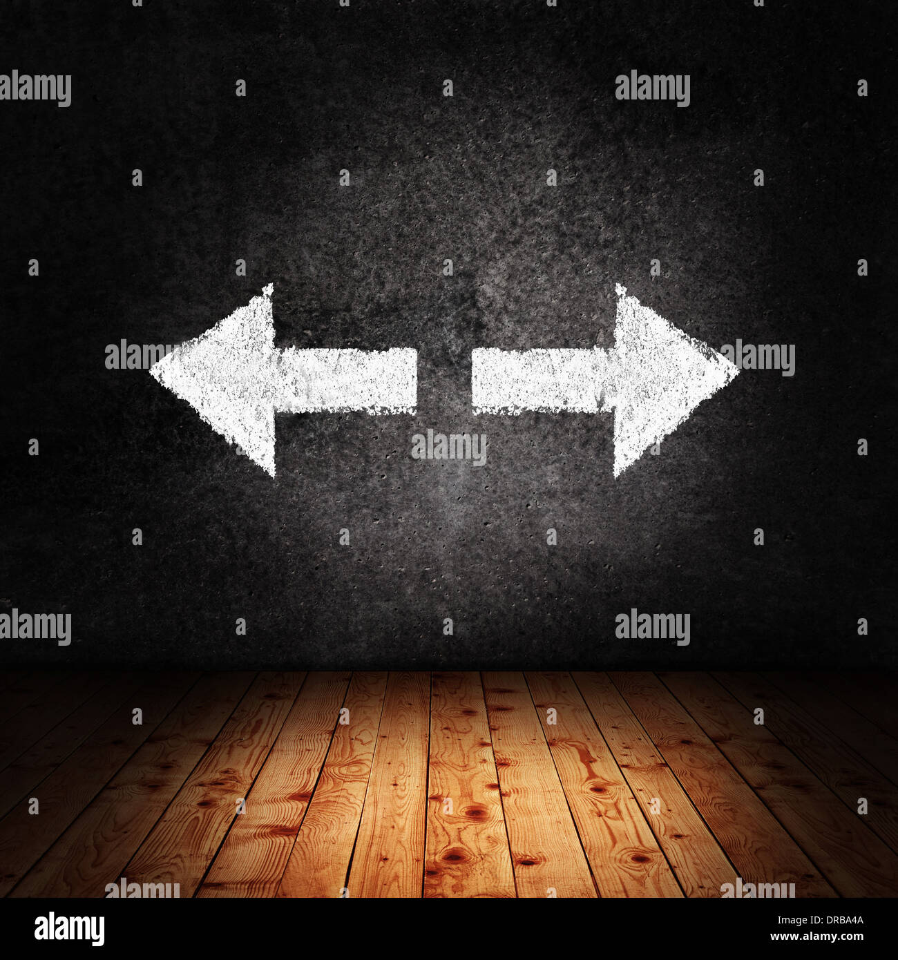 Concrete room with direction arrows on the wall Stock Photo - Alamy