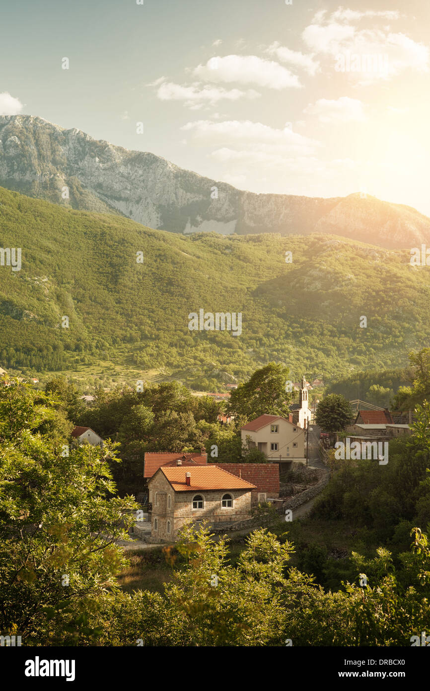panoramic view of nice green hill and small village Stock Photo - Alamy