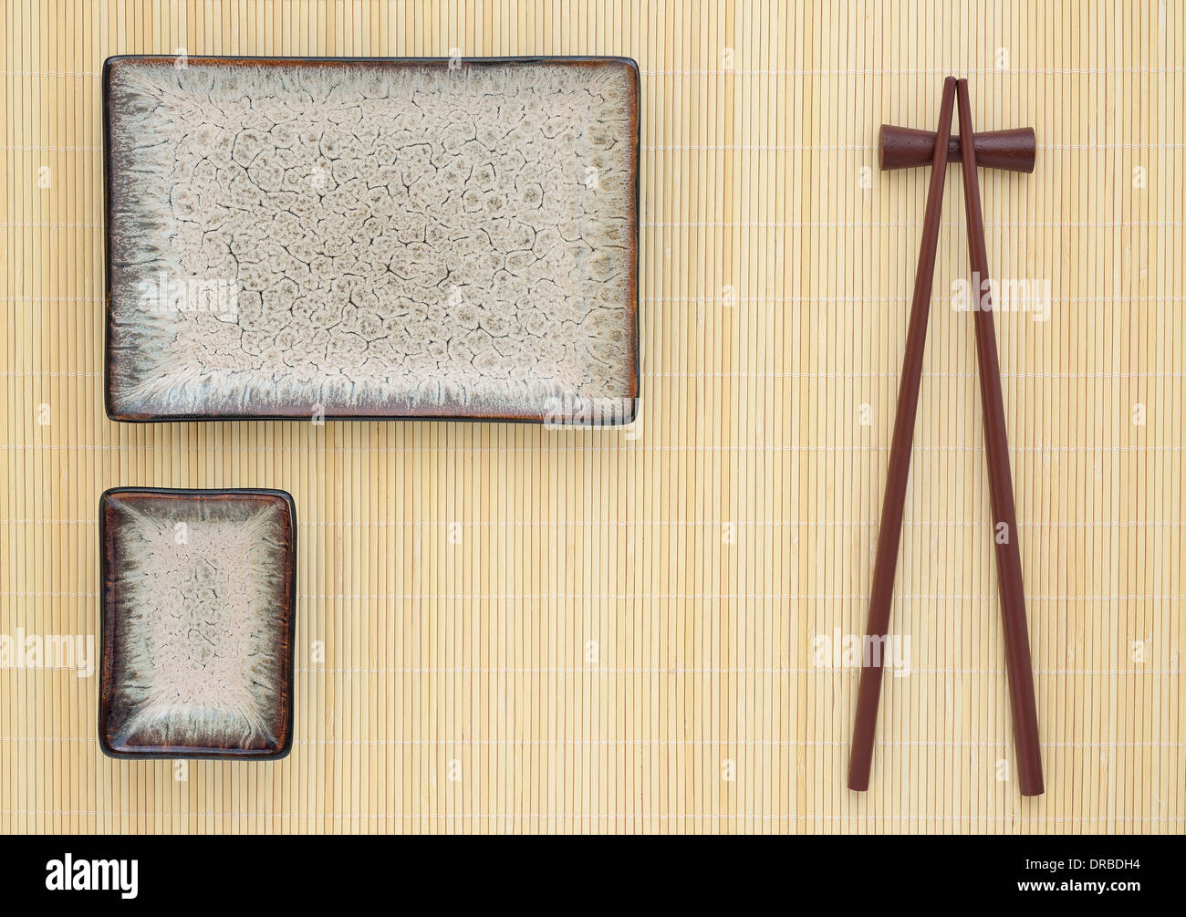 Empty dishes for sushi and rolls on a bamboo plate Stock Photo - Alamy