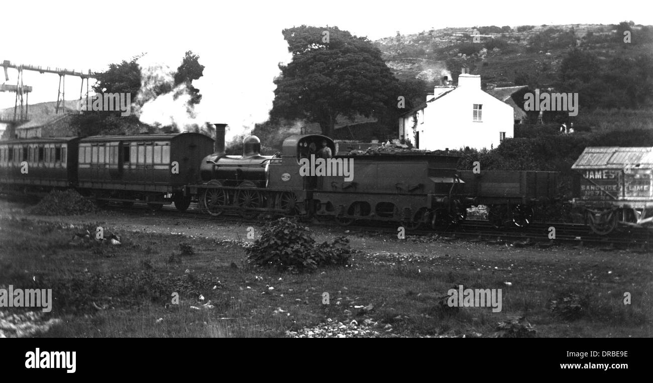 Furness Railway 0-6-0 steam engine hauling a passenger train at Kellet ...