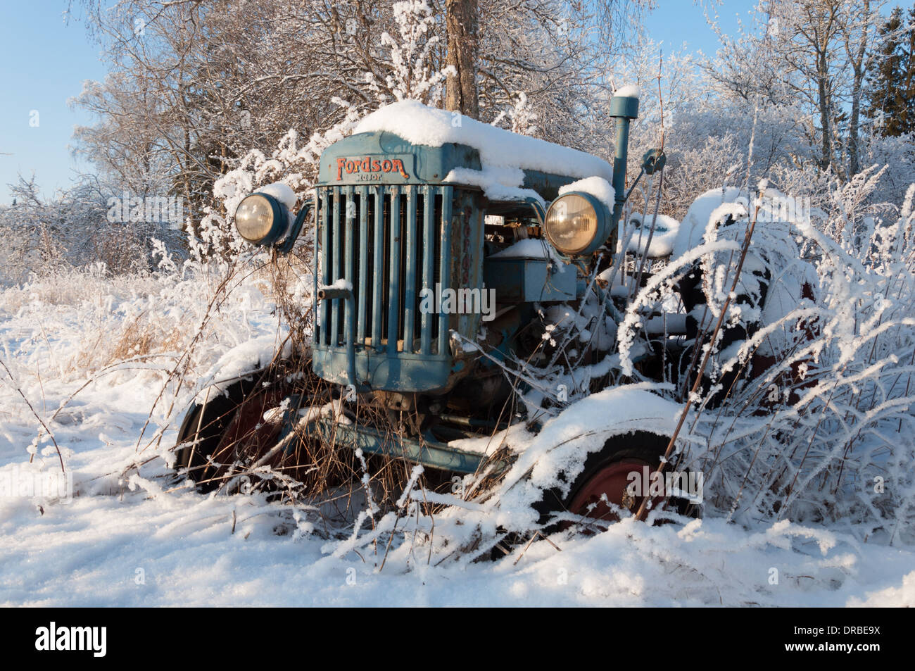 Snow covered old Fordson tractor in Finland Stock Photo - Alamy