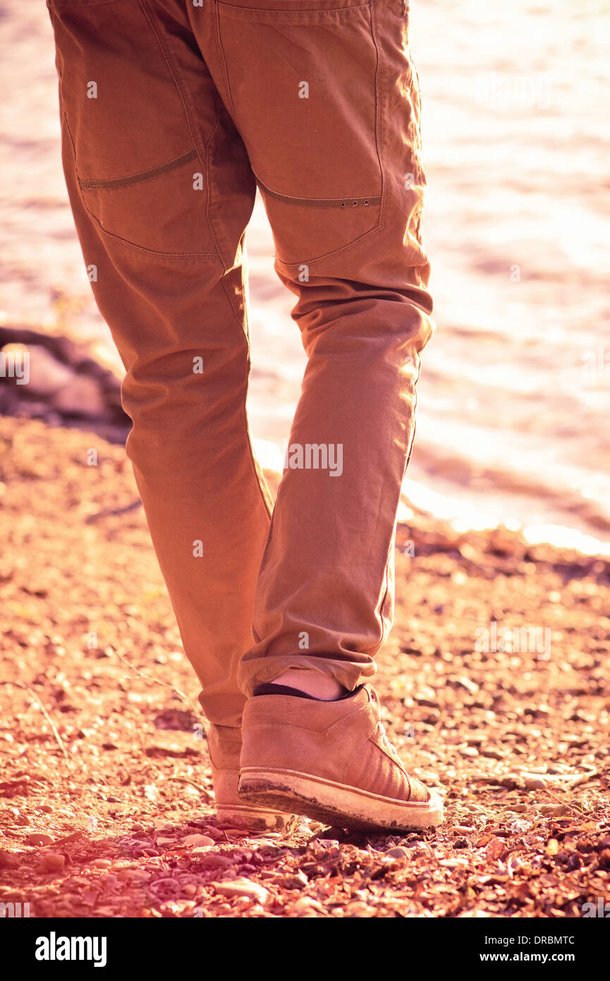 Foot man walking outdoor on beach trendy style melancholy concept Stock ...