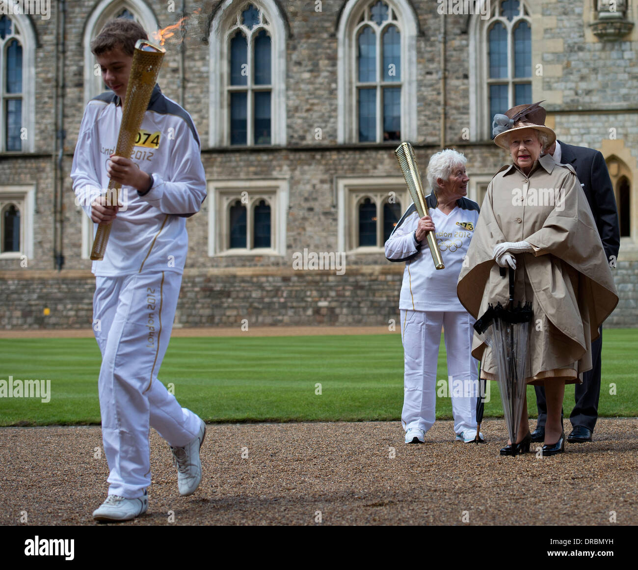 Britain's Queen Elizabeth II(R) as Phil Wells (L) leaves carrying the ...