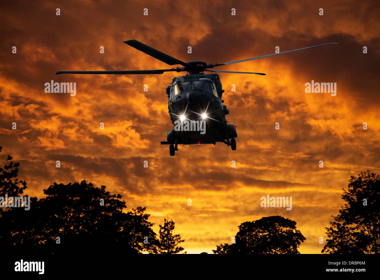 Helicopter at sunset Stock Photo - Alamy