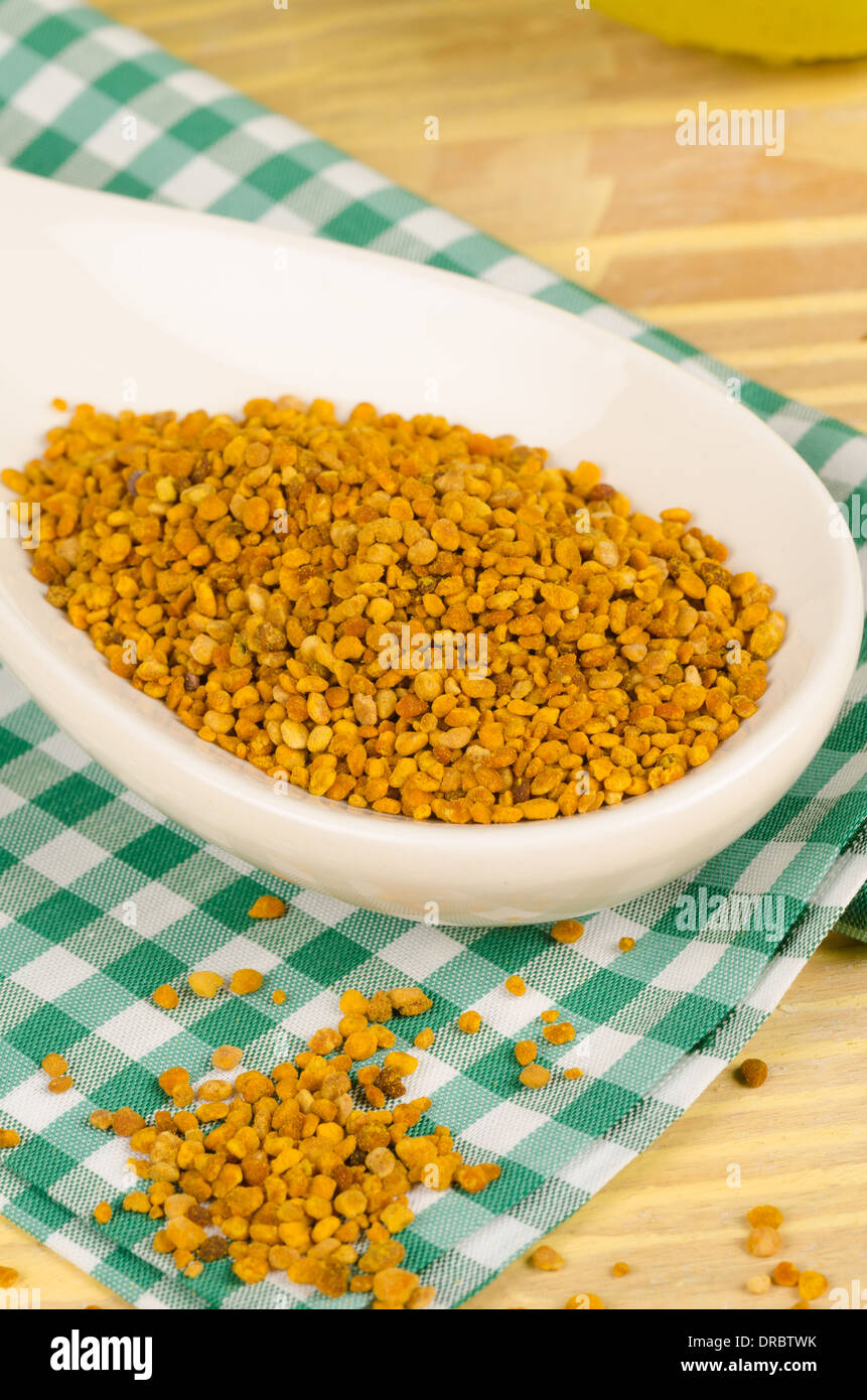Scoop full of fresh pollen granules, healthy food Stock Photo - Alamy