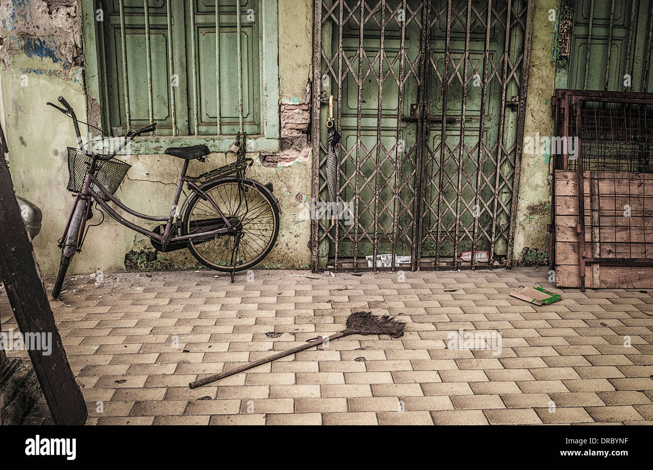 Ramshackle building with metal door and window grilles, in need of ...