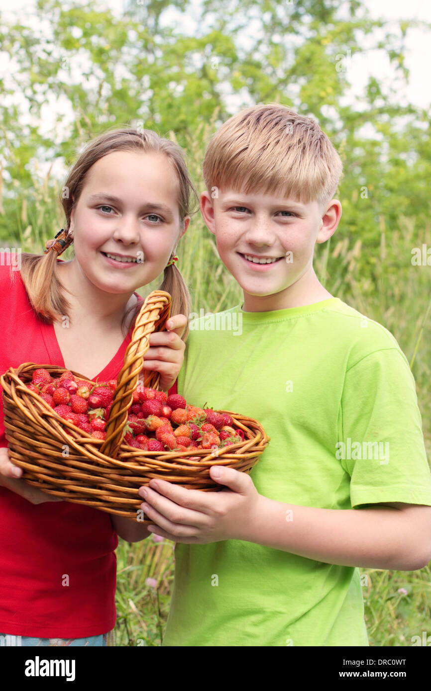 children with berries outdoor Stock Photo - Alamy