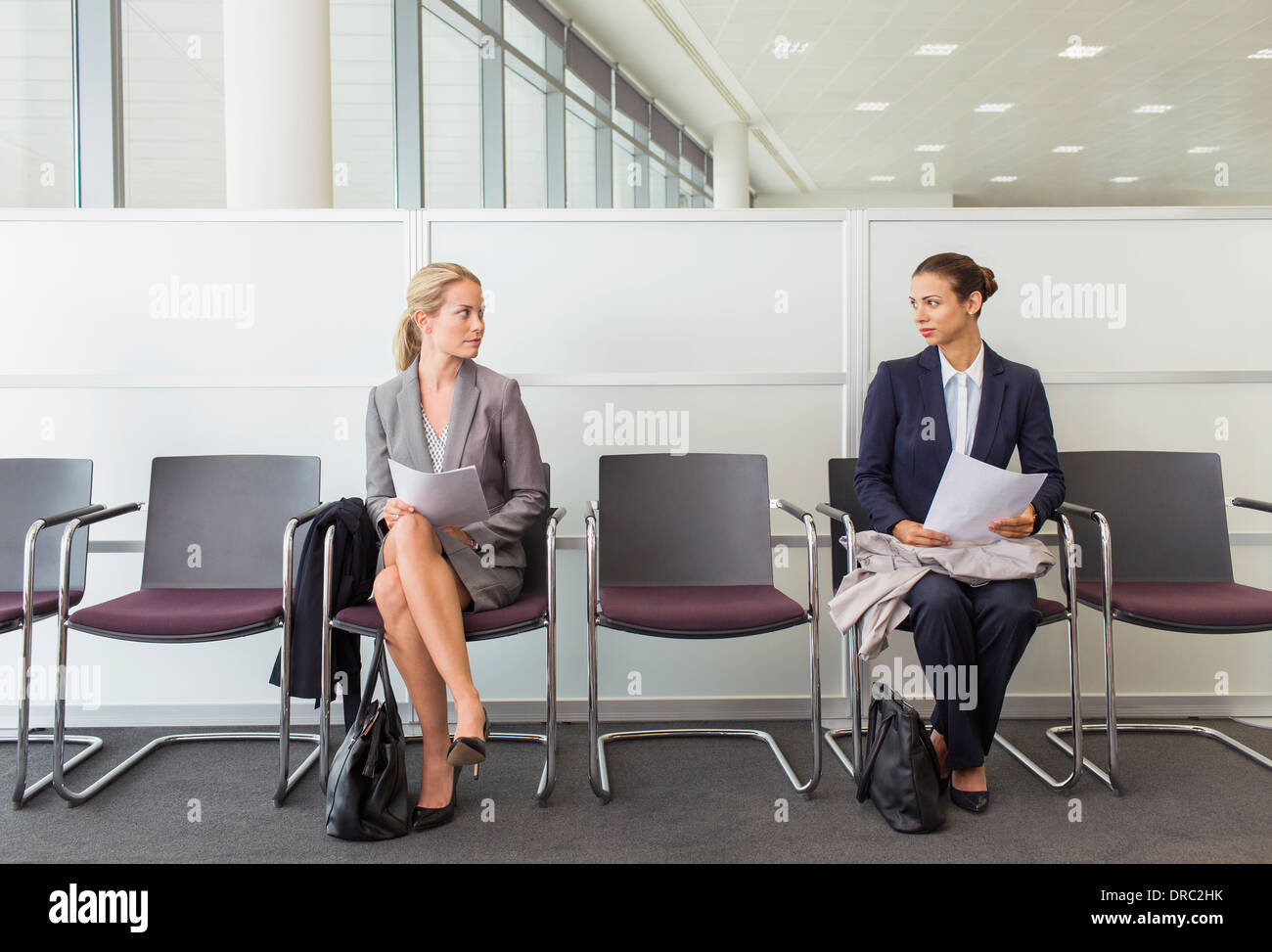Businesswomen sitting in waiting area Stock Photo - Alamy