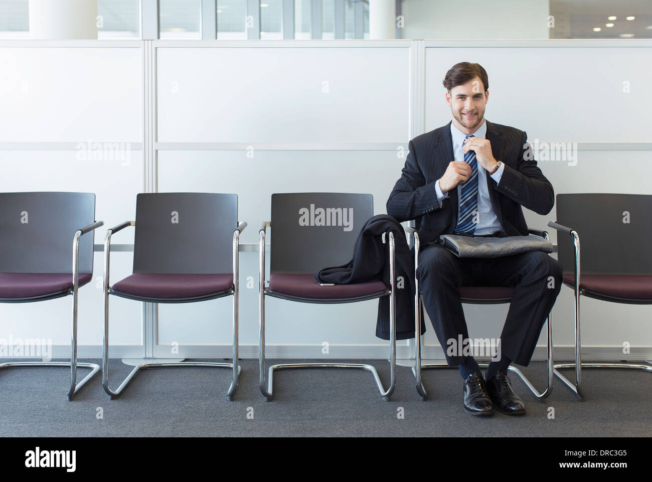 Woman sitting waiting in hi-res stock photography and images - Alamy