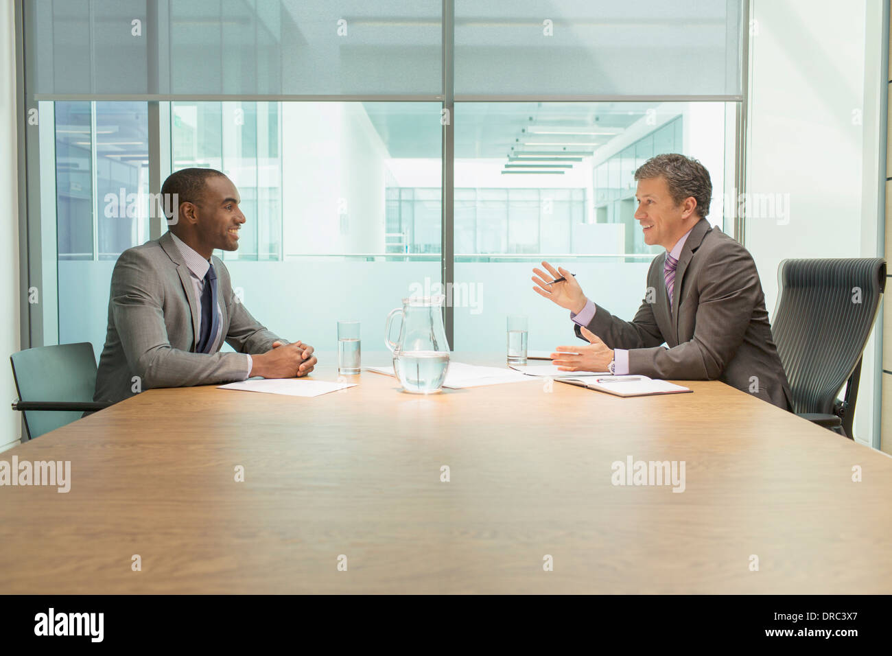 Two man talking table hi-res stock photography and images - Alamy